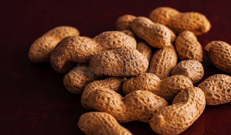 Peanuts in Nutshell on a Piece of Wood Stock Image - Image of groundnut ...