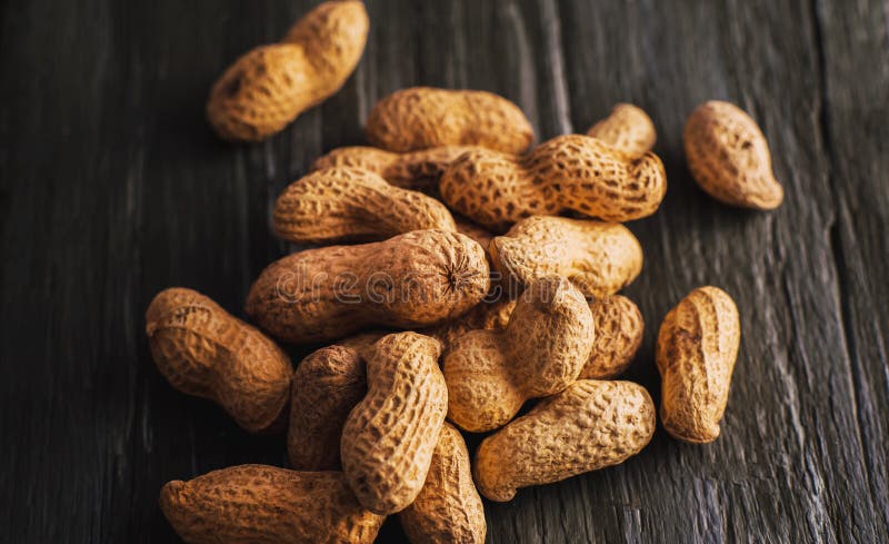 Peanuts in Nutshell on a Piece of Wood Stock Photo - Image of seed ...