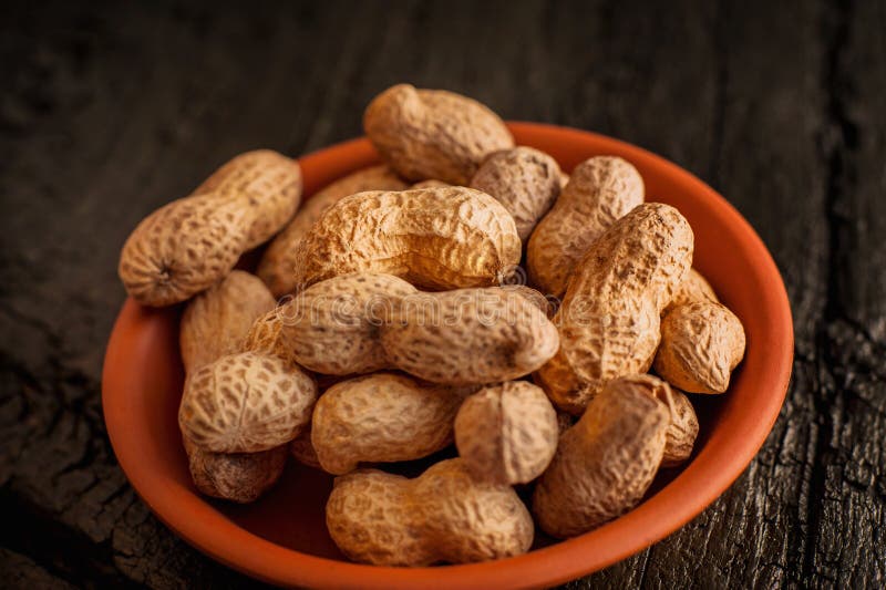 Peanuts in Nutshell on a Piece of Wood Stock Image - Image of nutshell ...