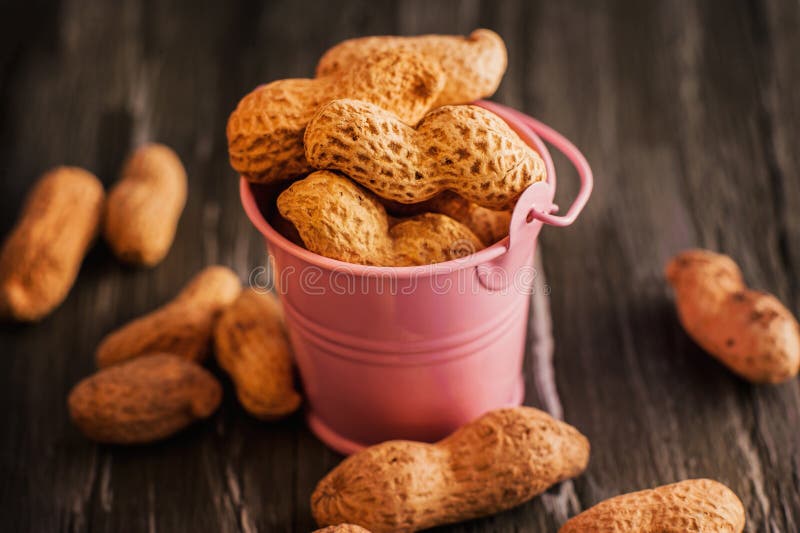 Peanuts in Nutshell on a Piece of Wood Stock Image - Image of ...