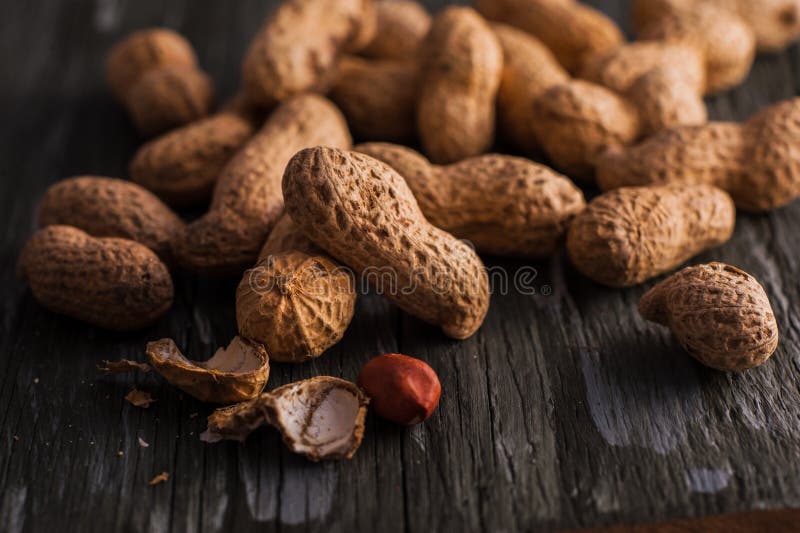 Peanuts in Nutshell on a Piece of Wood Stock Image - Image of protein ...