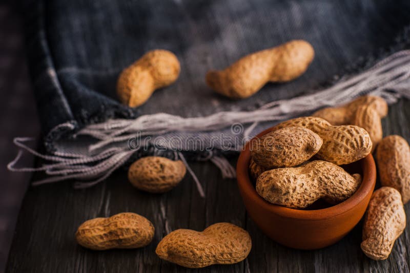 Peanuts in Nutshell on a Piece of Wood Stock Image - Image of nutshell ...