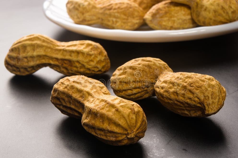 Peanuts in Shell on Dark Background, Close Up Stock Photo - Image of ...