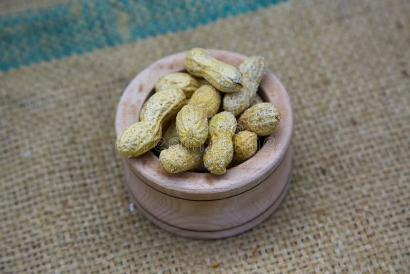 Peanuts in Small wood Bowl stock photo. Image of green - 194070798