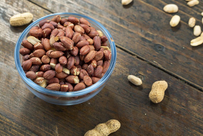 Peanuts in Their Husks in a Glass Bowl and Peanuts in Their Skins are ...