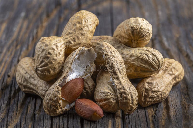 Peanuts in Their Shells Arranged on a Rustic Wooden Surface Showcasing ...