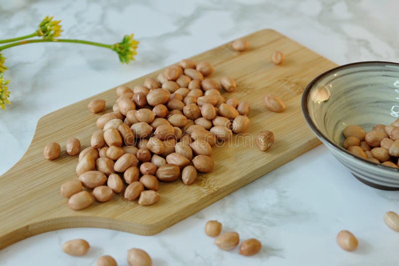 Peanuts on Top of Cutting Board Stock Photo - Image of soil, dish ...