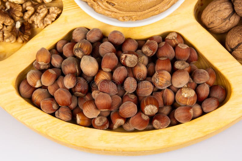 Peanuts, Walnuts and Hazelnuts in a Wooden Box with Compartments. Three ...