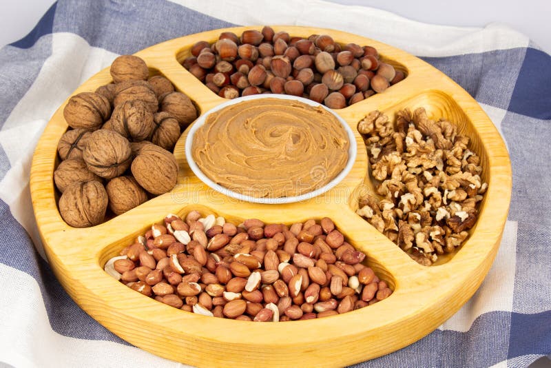Peanuts, Walnuts and Hazelnuts in a Wooden Box with Compartments. Three ...