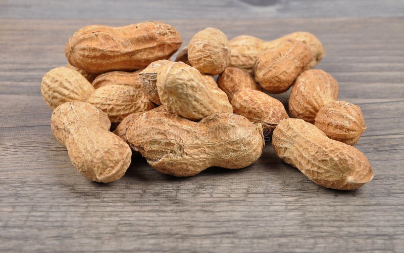Peanuts on wood stock image. Image of macro, groundnut - 40382107
