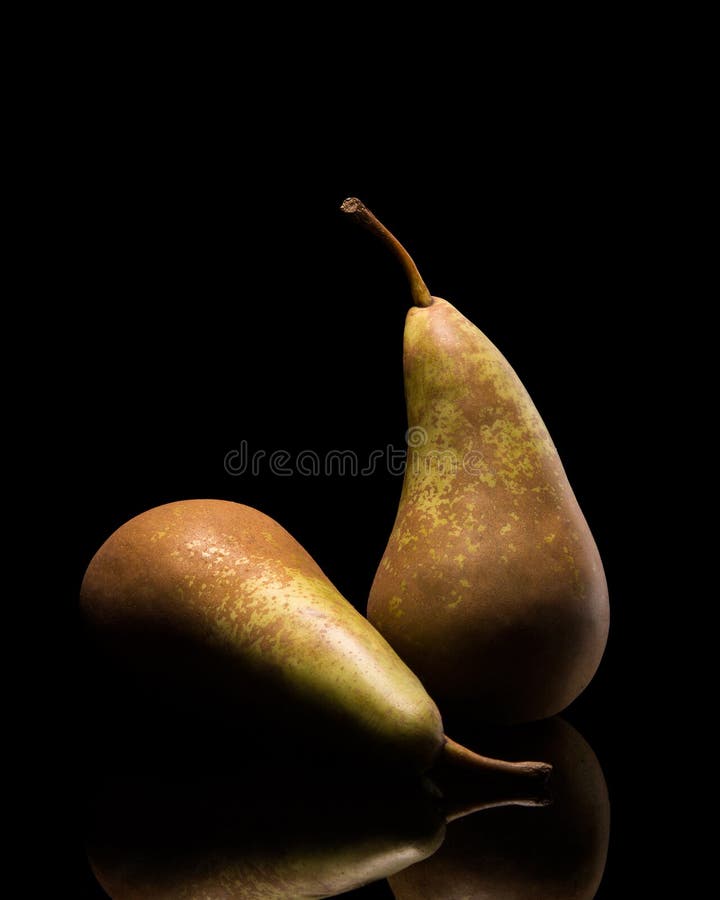 Brown Pears On Black Isolated Background Stock Photo - Image of ...
