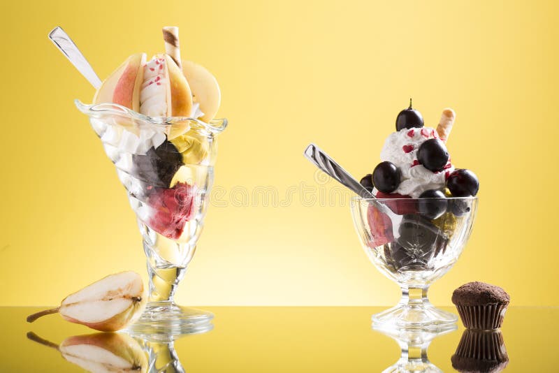 Pear Cup and Red Grapes Sundaes on Yellow Backgound Stock Image - Image ...