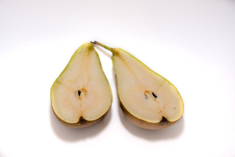 Pear Cut into Two Pieces on a White Background Stock Image - Image of ...