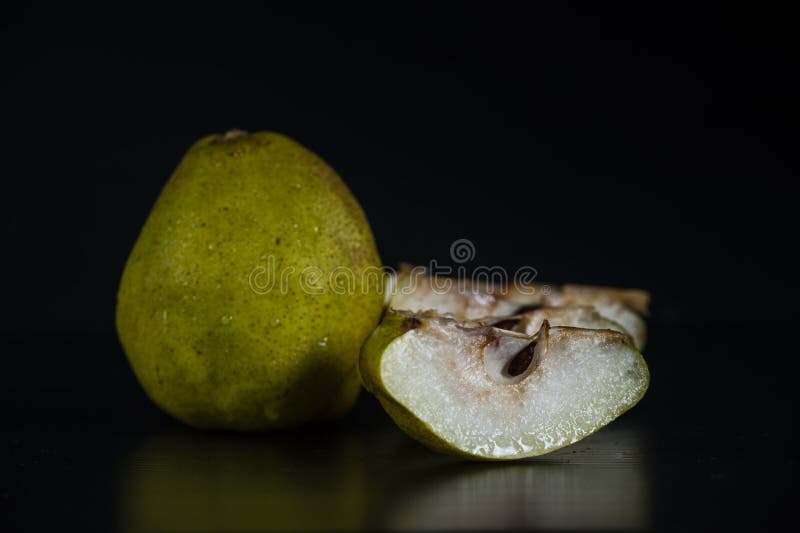 Pear in dark on black stock photo. Image of shiny, sliced - 48942438