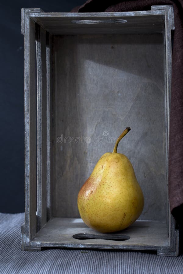 The Pear in an Inverted Grey Wooden Decorative Box Stock Photo - Image ...