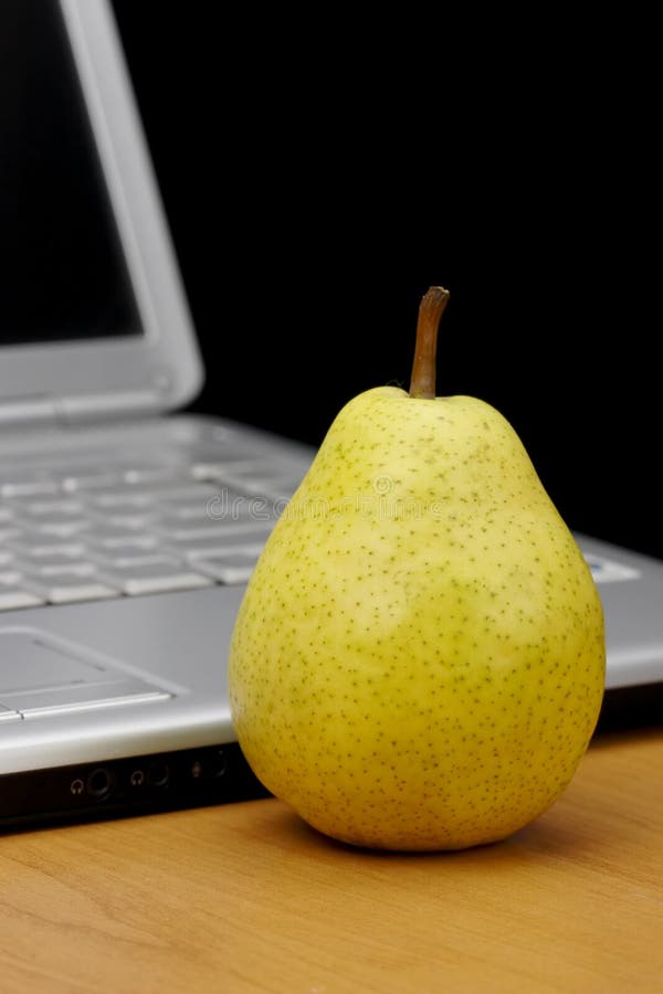 Pear,pen and laptop. stock photo. Image of food, sweet - 11834334