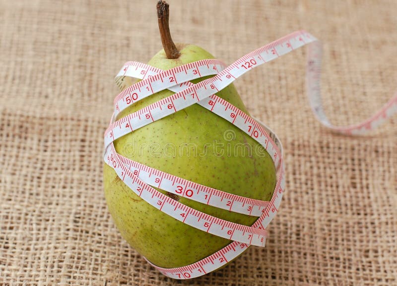Pear with Meter on the Brown Background, Front View Stock Image - Image ...