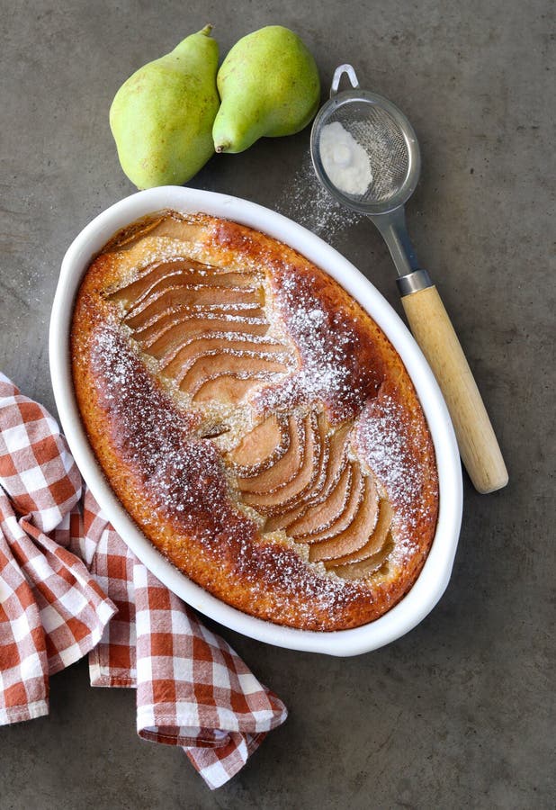 Pear Pudding with Powdered Sugar Stock Photo - Image of flatlay ...