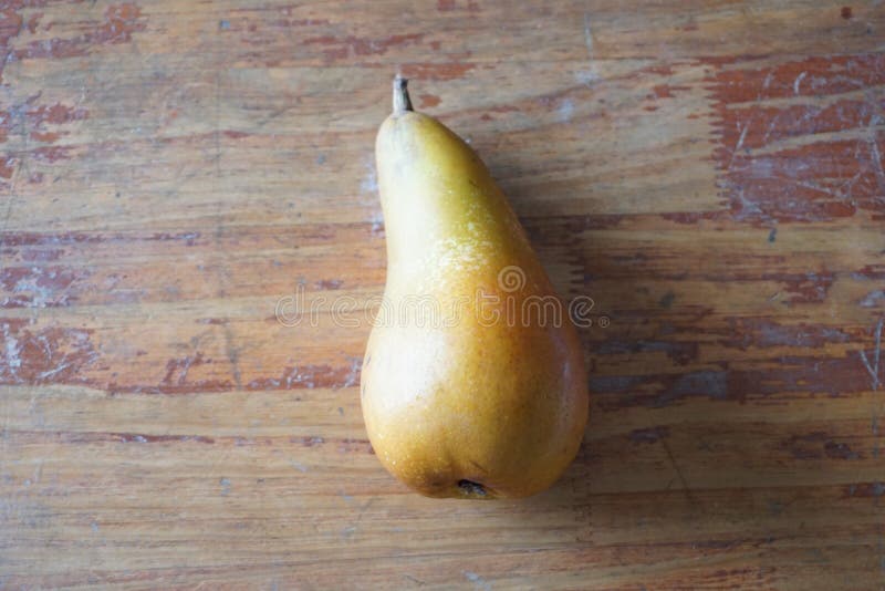 A pear on the table stock image. Image of striped, dining - 153896415