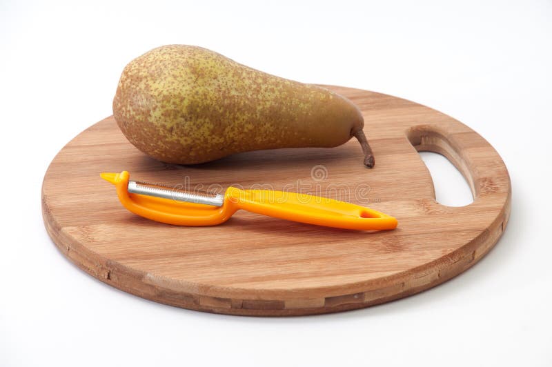 Pear with a Tool for Peeling on a Kitchen Board Stock Photo - Image of ...