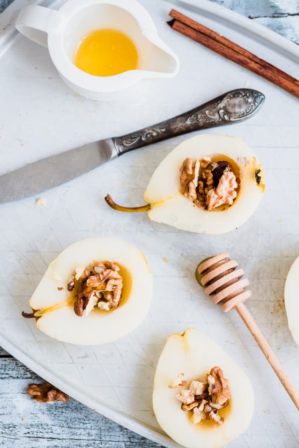 Pear with Walnuts and Honey before Baking, Cinnamon Sticks Stock Photo ...