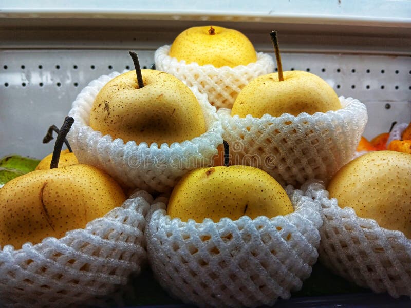 Pear wrapped in net foam stock photo. Image of freshness - 297754552