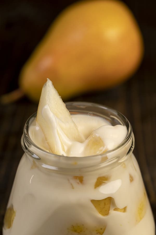 Pear Yogurt with Pieces of Fruit on the Table Stock Photo - Image of ...