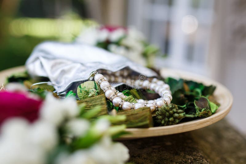 Pearl jewelry on a plate stock photo. Image of pearl - 56693320