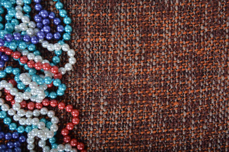 Pearl Necklace on the Brown Fabric Background Texture. Left Composition ...