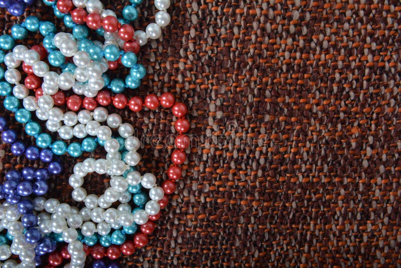 Pearl Necklace on the Brown Fabric Background Texture. Left Composition ...