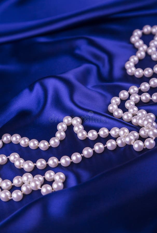 Pearl Necklace on Dark Blue Satin Fabric Stock Image - Image of tender ...