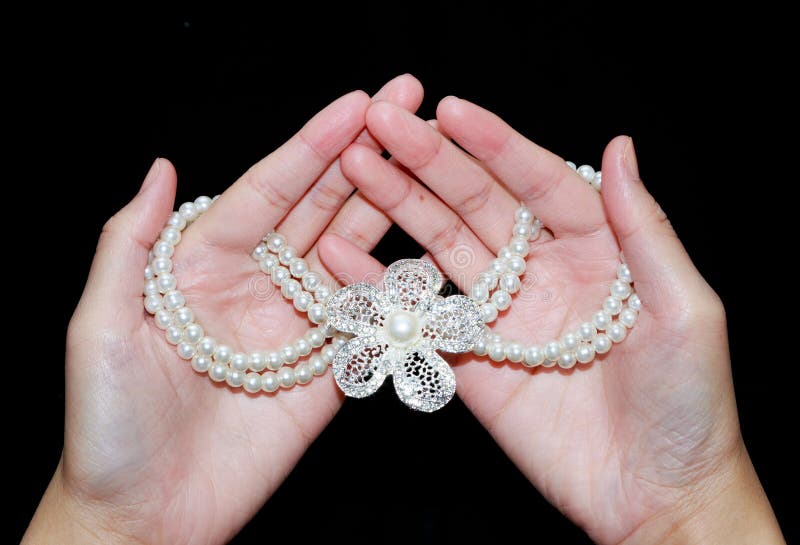 Pearl necklace on hand stock photo. Image of necklace - 109902722