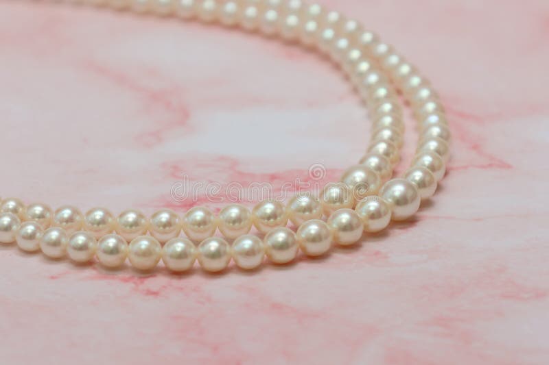 Pearl Necklace Isolated on a Pink Marble Pattern Background Stock Image ...