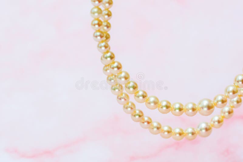 Pearl Necklace Isolated on a Pink Marble Pattern Background Stock Image ...