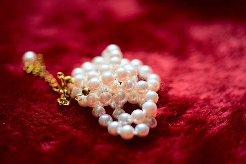 Pearl Necklace on Plush Red Material Stock Image - Image of decadence ...