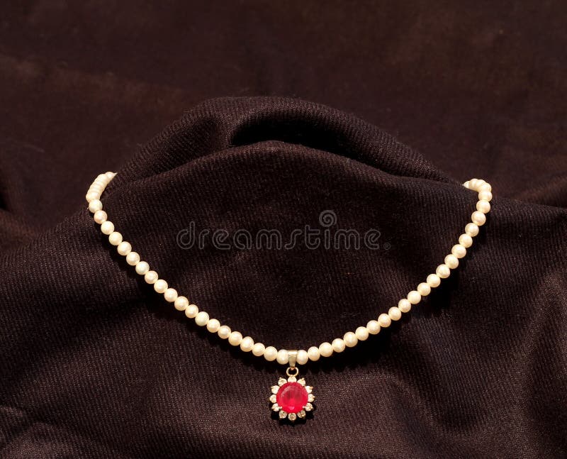 Pearl Necklace with Red Ruby Stone in Black Background Stock Image ...