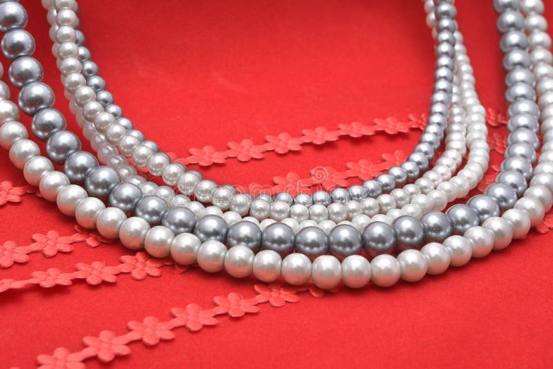 Pearl Threads on Red Velvet Stock Photo - Image of necklace, flower ...