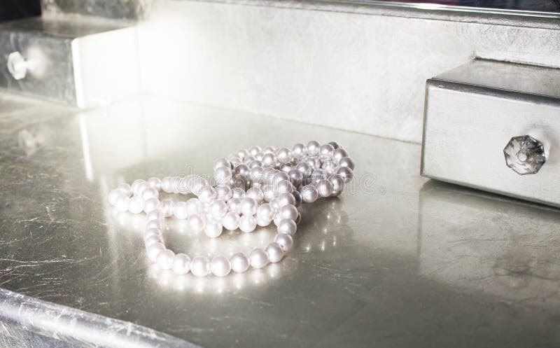 Pearls on dressing table. stock image. Image of glamour - 85437013