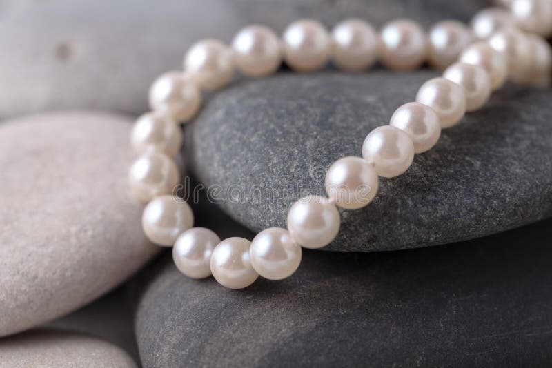 Pearls a necklace on stone stock photo. Image of black - 124865050