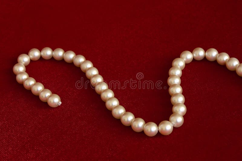 Pearls on red stock image. Image of beauty, macros, fashion - 10899569