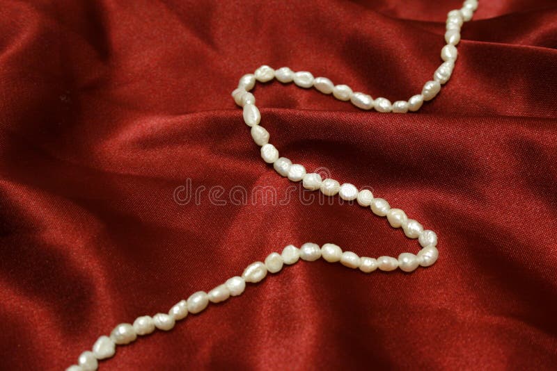 Pearls on red silk stock photo. Image of jewel, expensive - 4190742