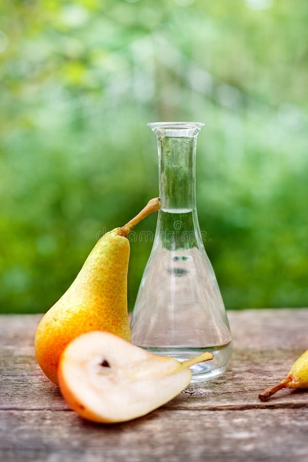 Pears and Fruit Brandy in Bottle Stock Photo - Image of distilled ...