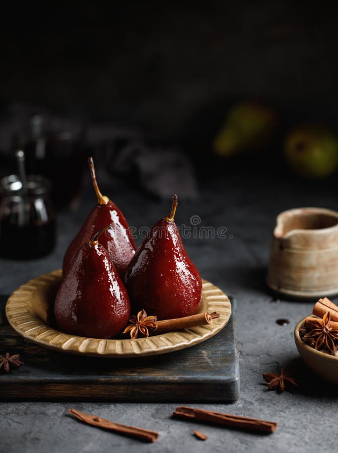 Pears in Red Wine on a Plate with Wine Syrup and Spices Stock Image ...