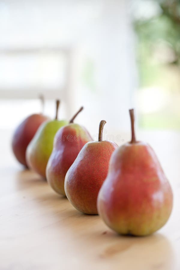 Pears in a row stock photo. Image of ripe, fruit, pears - 26666052