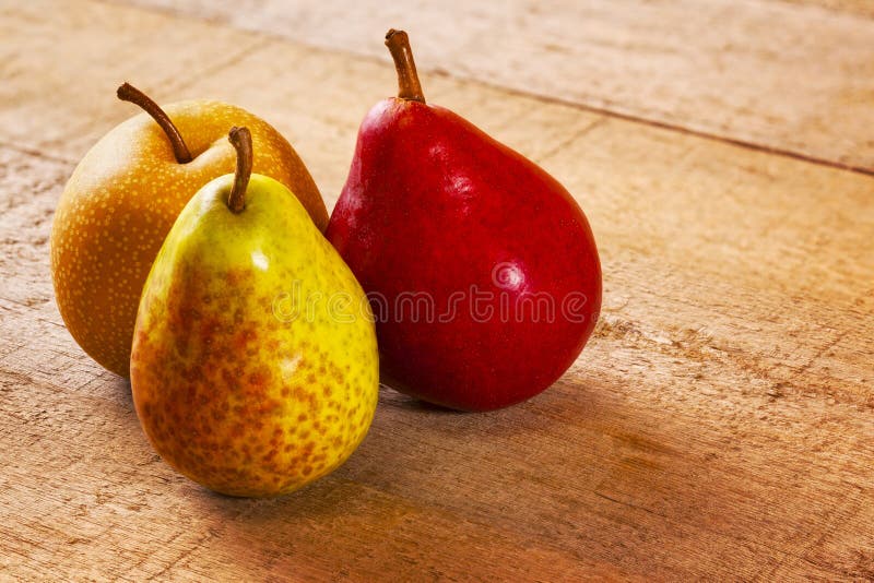 Pears on a Rustic Wood Surface Stock Photo - Image of space, pears ...