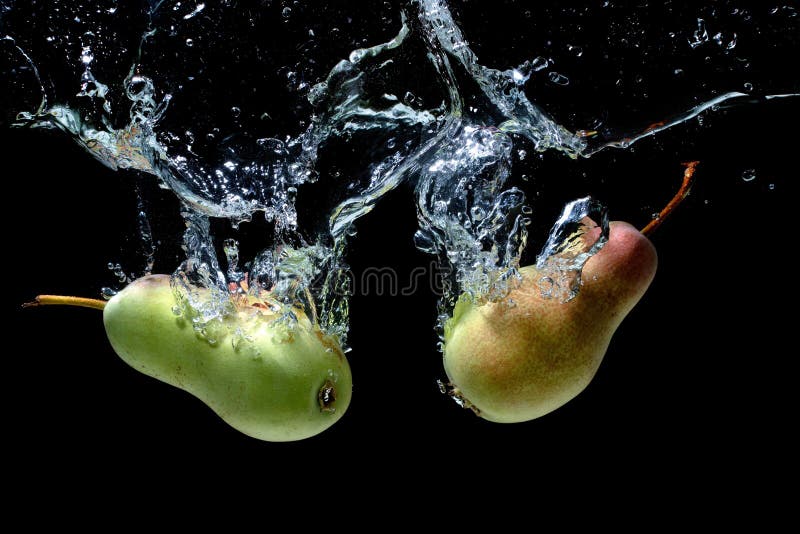 Pears Sinking Underwater with Splashes on Black Stock Photo - Image of ...