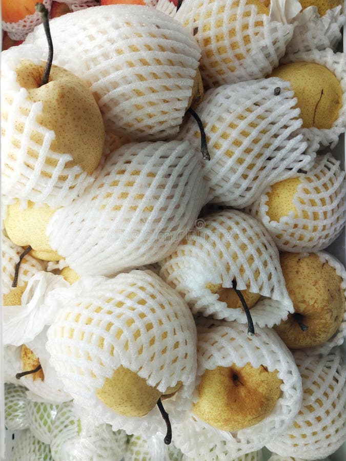 Pears Still Wrapped in the Market Stock Photo - Image of pears, wrapped ...