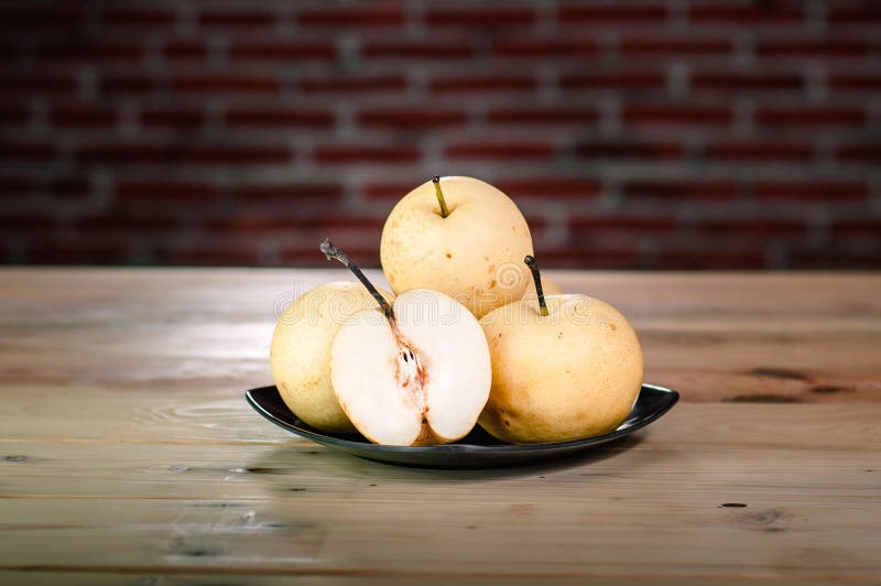 4 pears on the table stock image. Image of leaf, table - 210619807