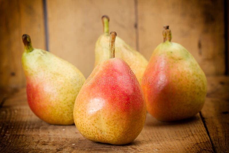 Pears on wooden table stock photo. Image of ripe, natural - 85680730