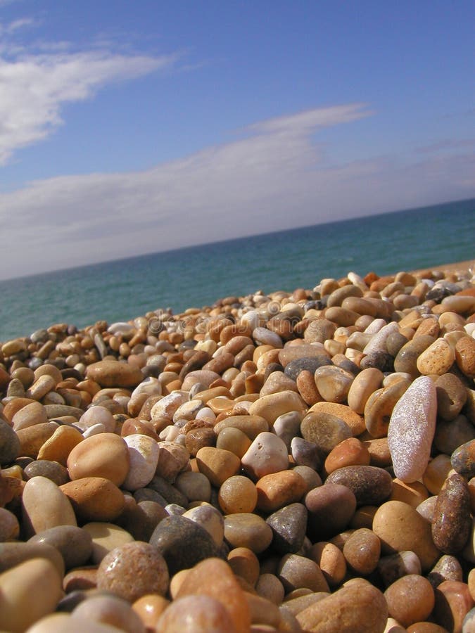 Pebble beach stock image. Image of glisten, empty, tide - 230371